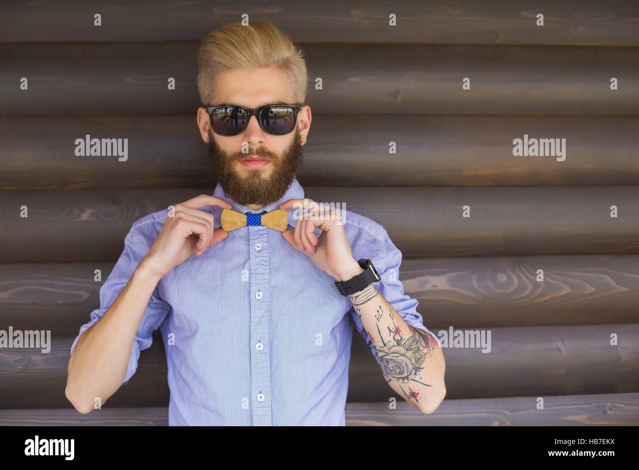 Stylish young hipster guy showing off with cool hand gestures Stock ...