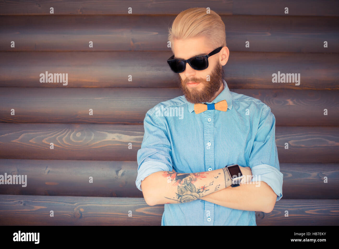 Stylish young hipster guy showing off with cool hand gestures Stock ...