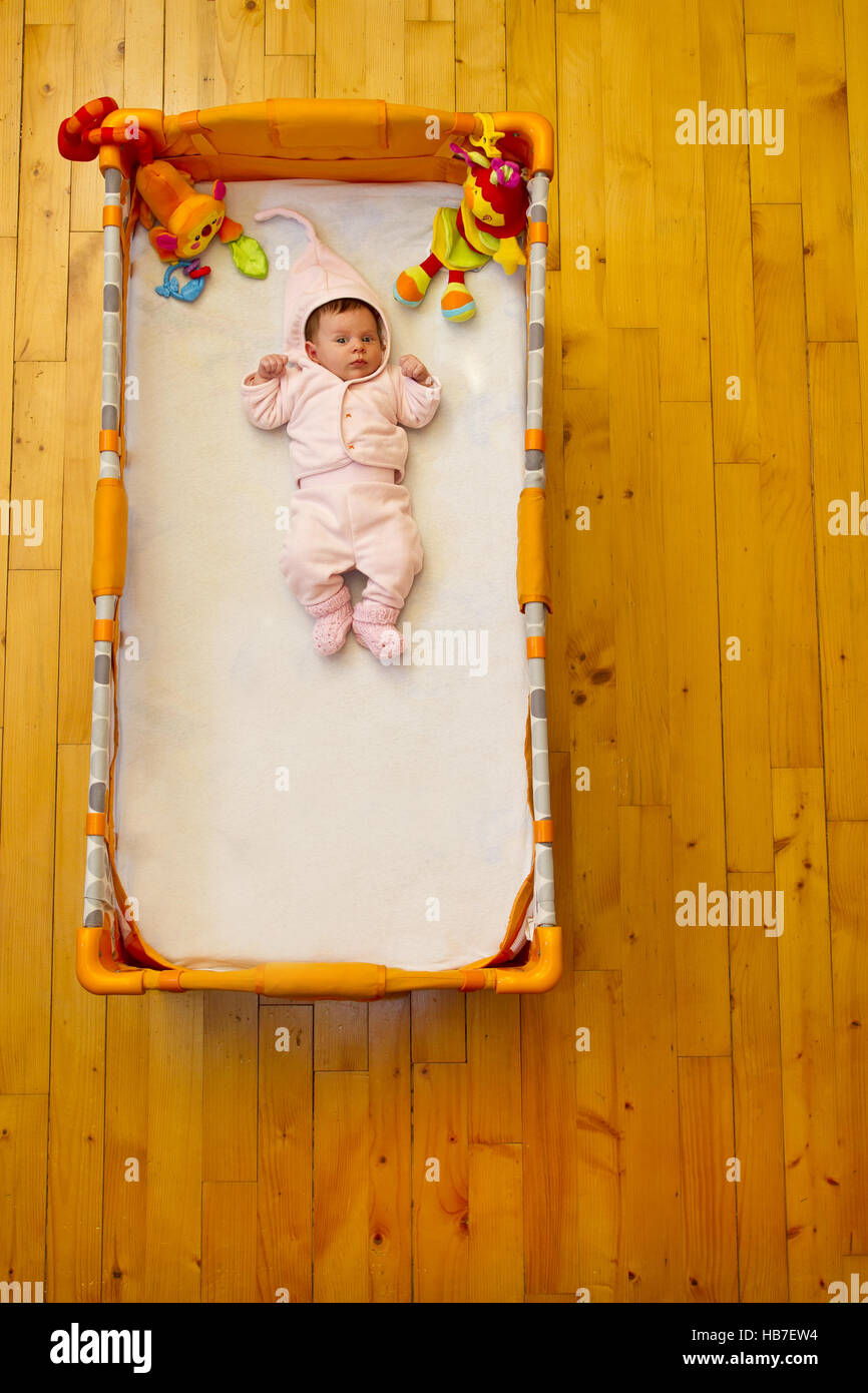 baby in her bed from above Stock Photo - Alamy
