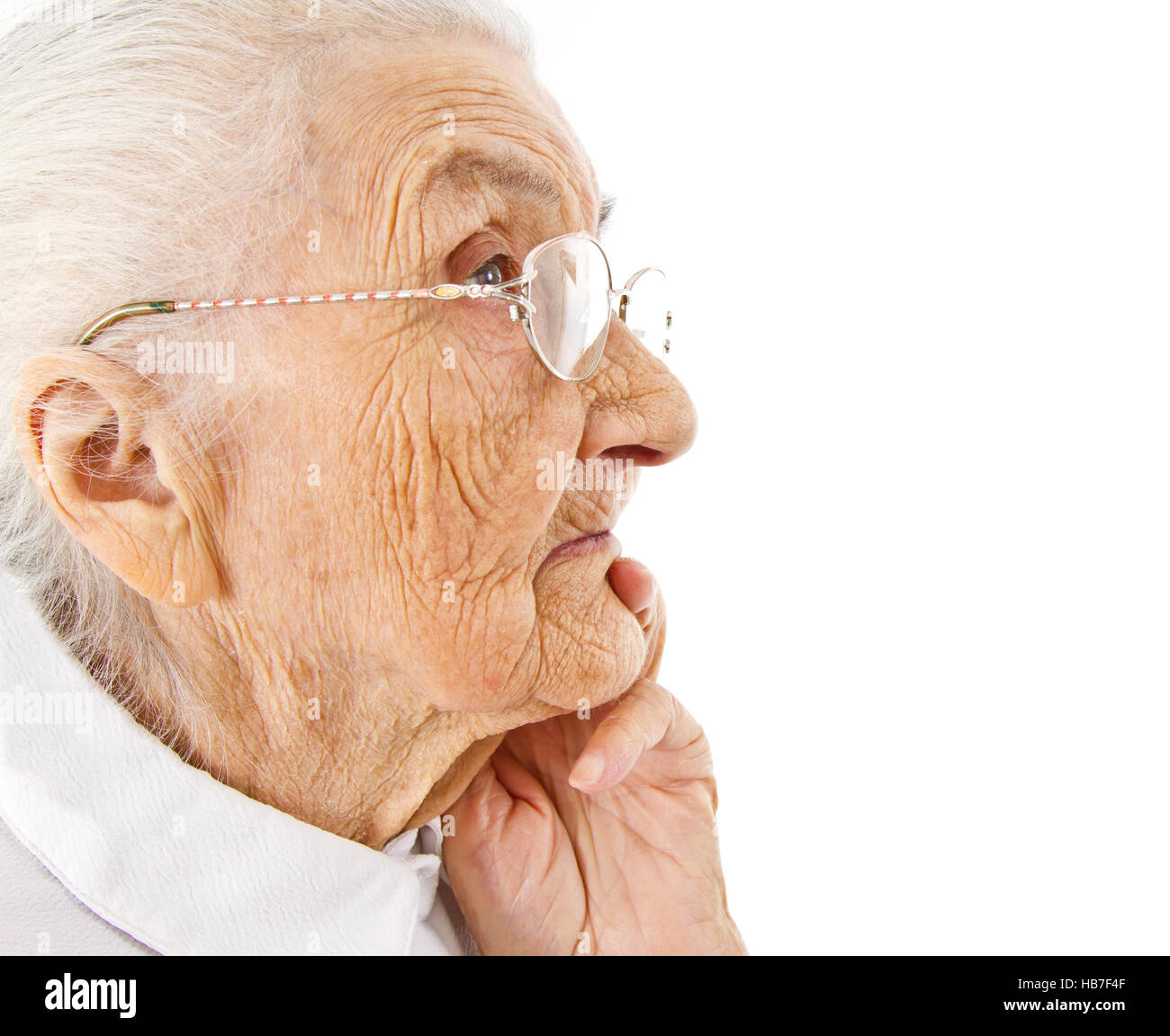 portrait of an old lady contemplating on an isolated background Stock ...