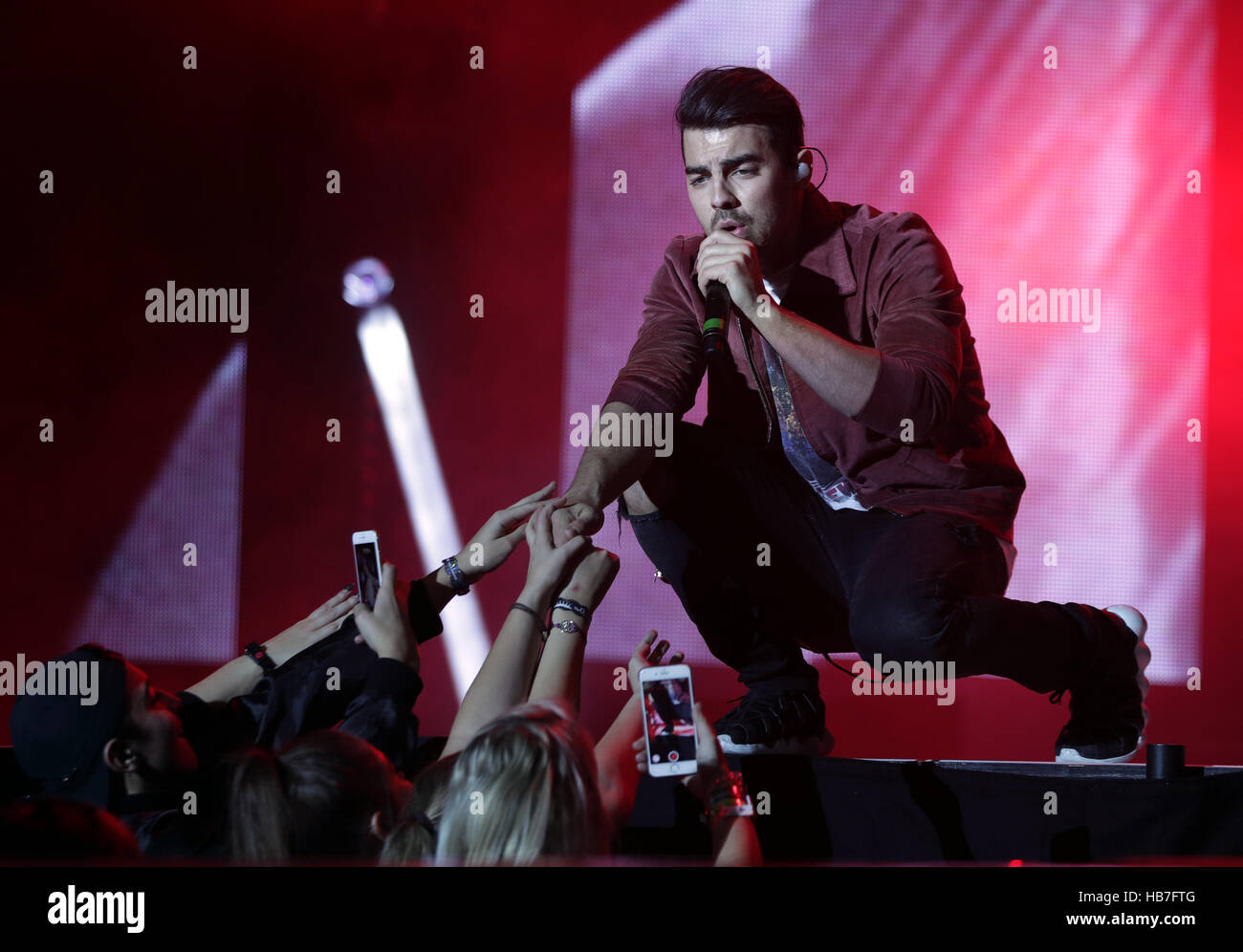 Joe Jonas of DNCE performing on stage on stage at Capital's Jingle Bell ...
