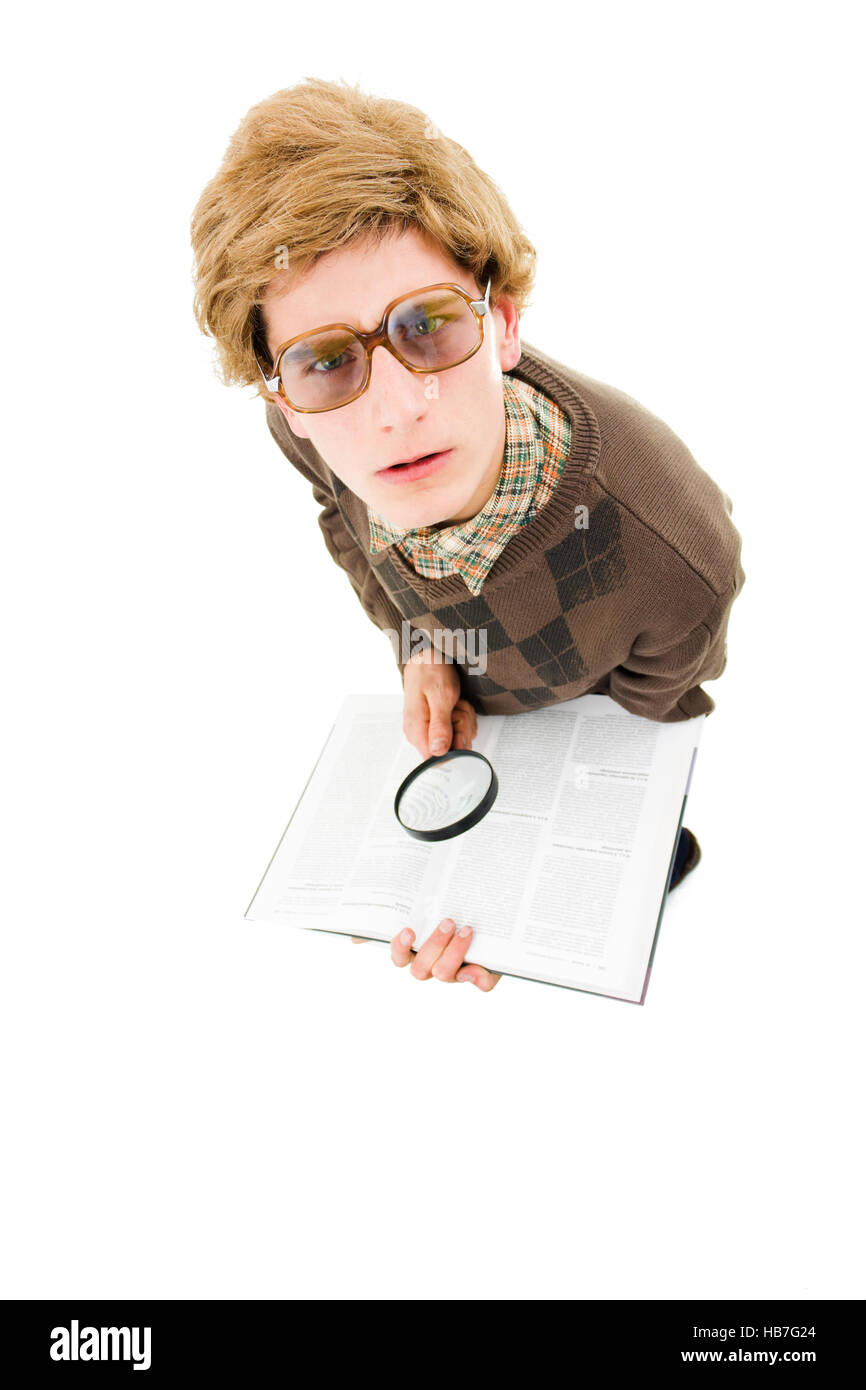 nerd guy with magnifier and book Stock Photo - Alamy