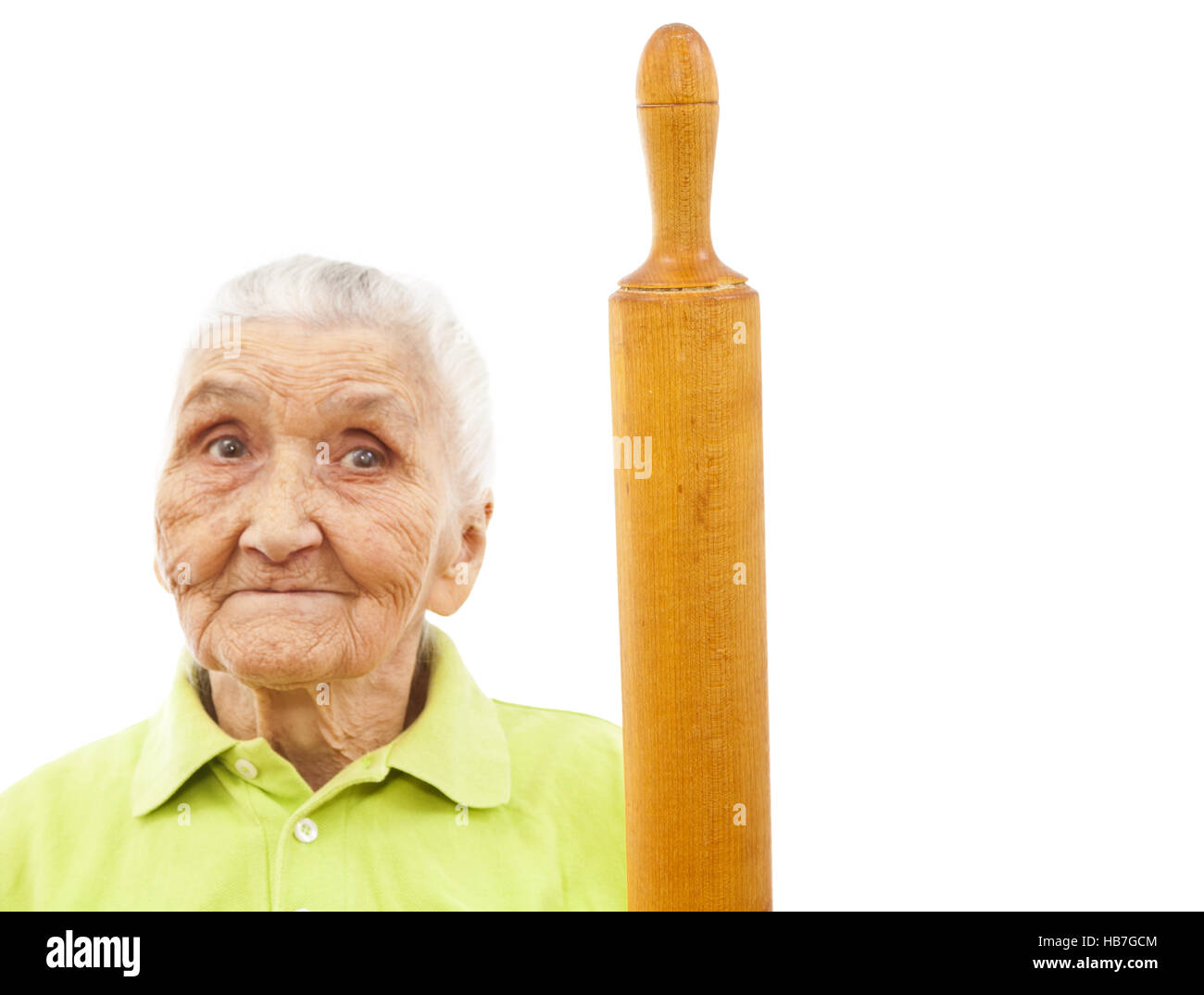 old woman smiling and holdinga rolling pin in her hands Stock Photo - Alamy