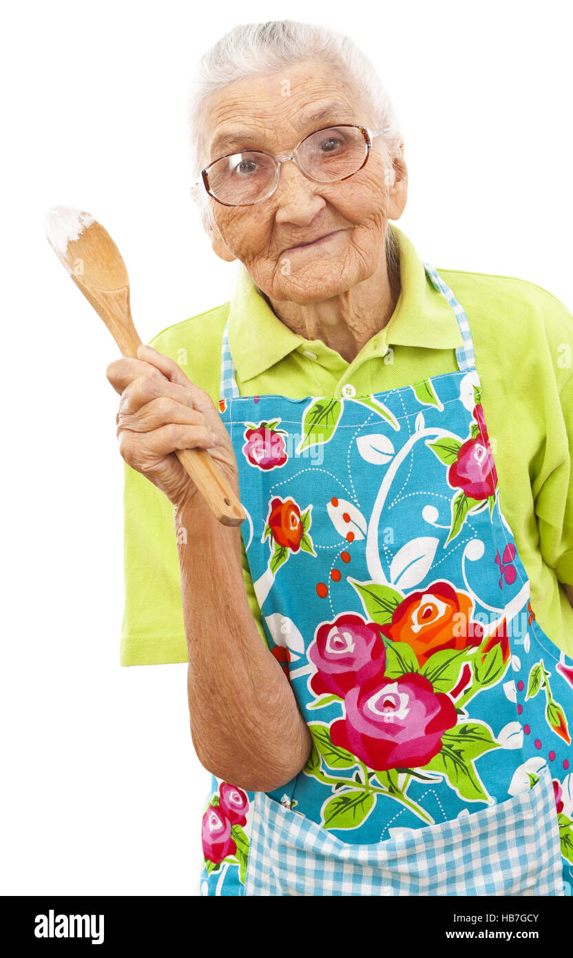 old woman holding a a wooden spoon in her hands Stock Photo - Alamy