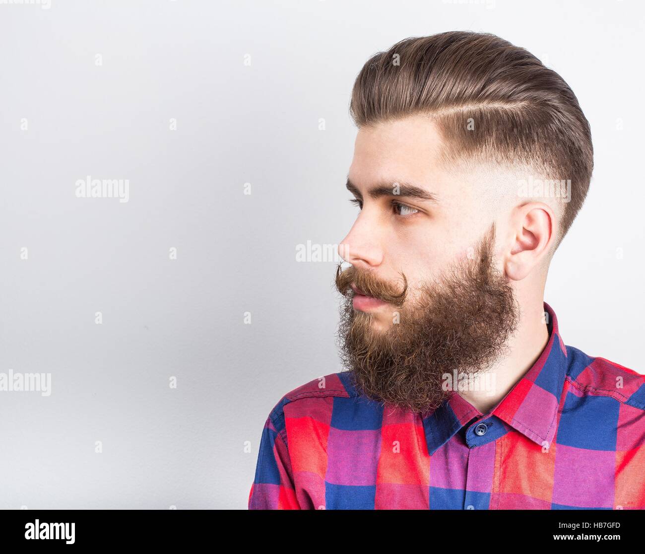Portait of a handsome hipster guy over white background Stock Photo - Alamy