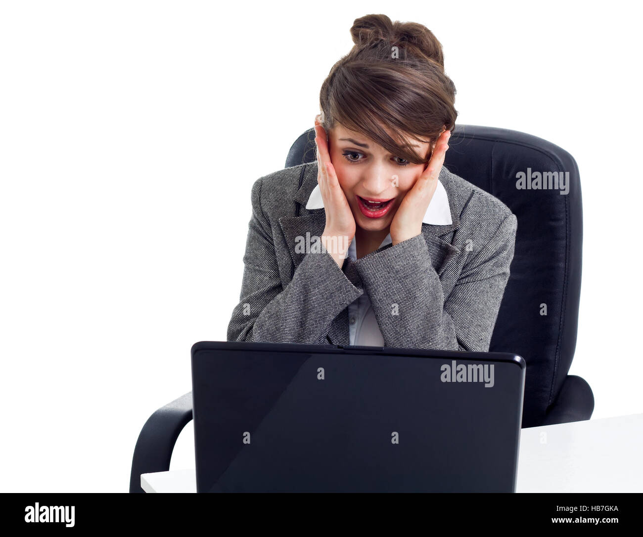 shocked business woman in front of laptop Stock Photo - Alamy