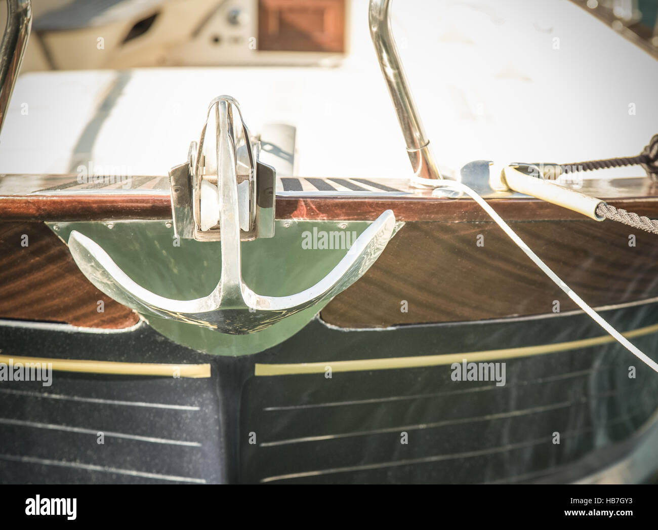 classic boat with anchor on water Stock Photo - Alamy