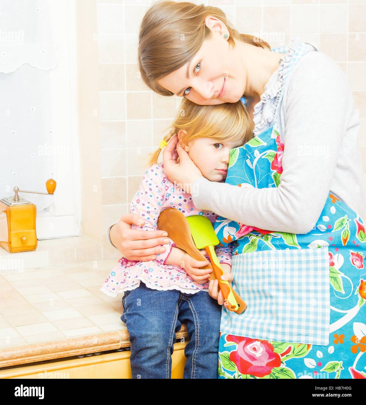 Kind mother hugging her little pretty daughter Stock Photo - Alamy