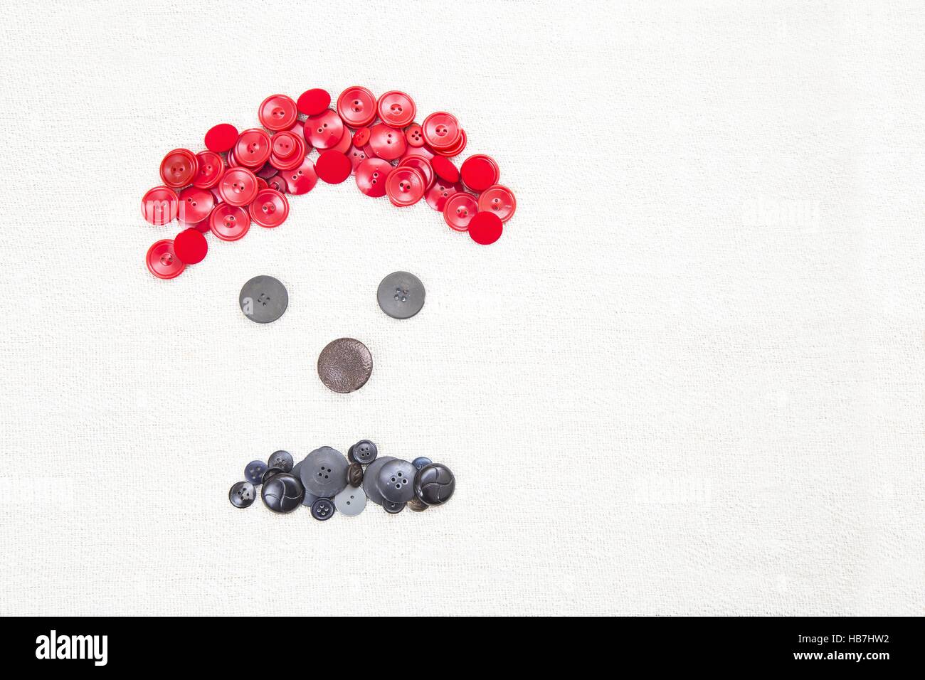 Sad face made out of colorful buttons Stock Photo - Alamy