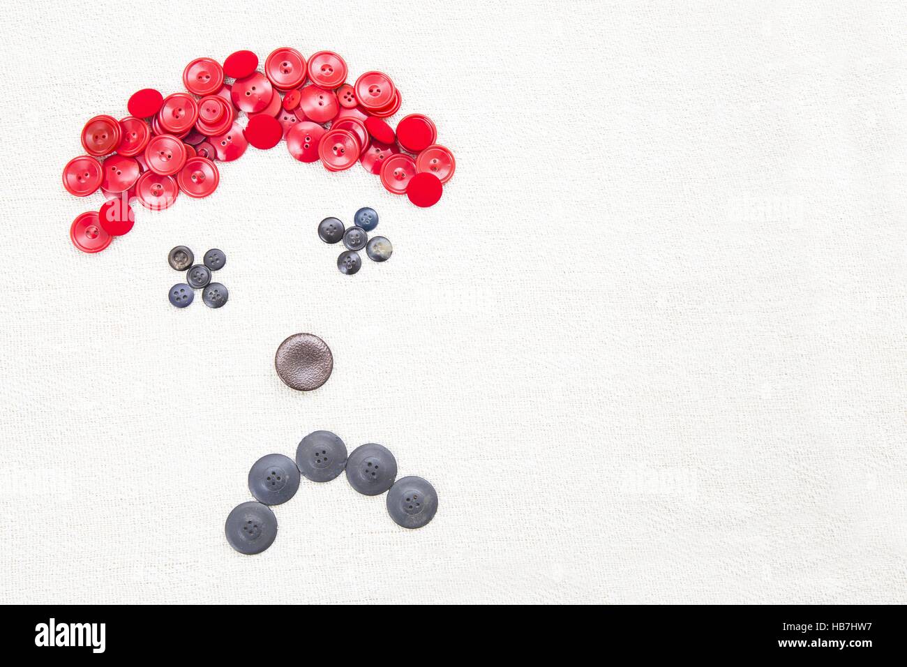 Sad face made out of colorful buttons Stock Photo - Alamy