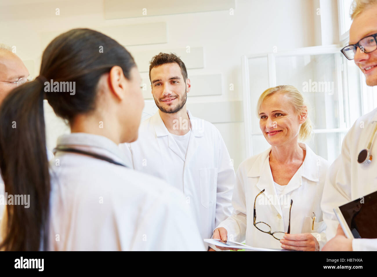 Team of doctors in meeting as teamwork concept in hospital Stock Photo ...