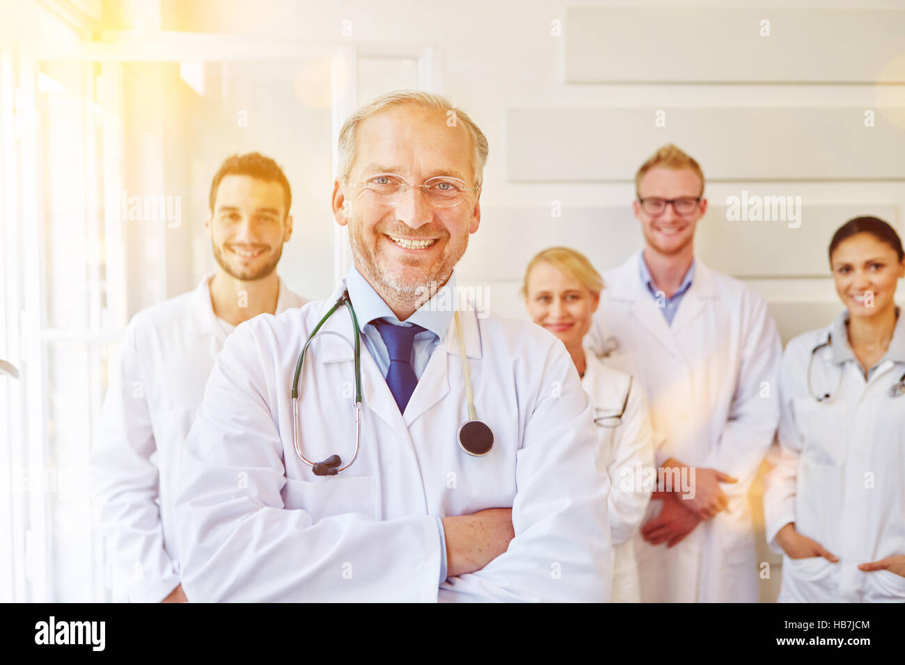 Chief physician and his successful team at hospital Stock Photo - Alamy