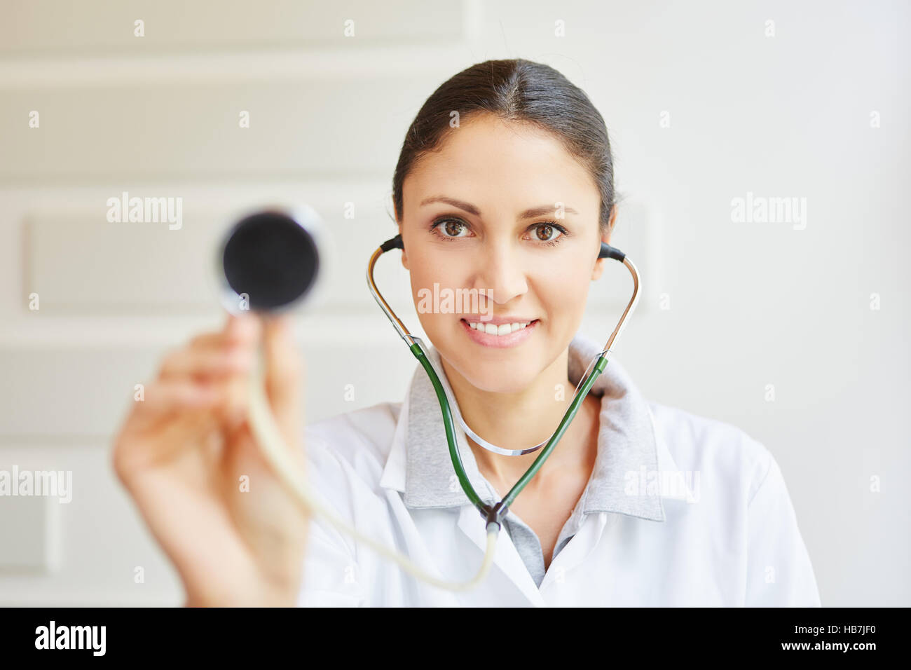 Woman doctor with stethoscope as medical tool Stock Photo - Alamy