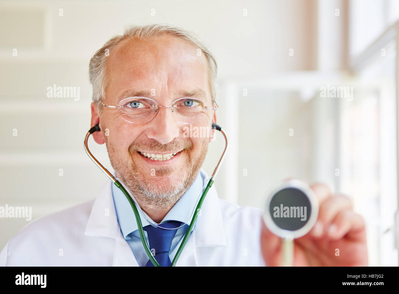 Friendly and kind senior doctor with stethoscope Stock Photo - Alamy