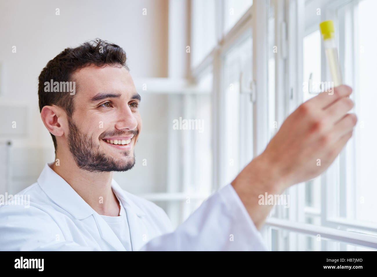 Successfull scientist makes experiment analysis at lab Stock Photo - Alamy