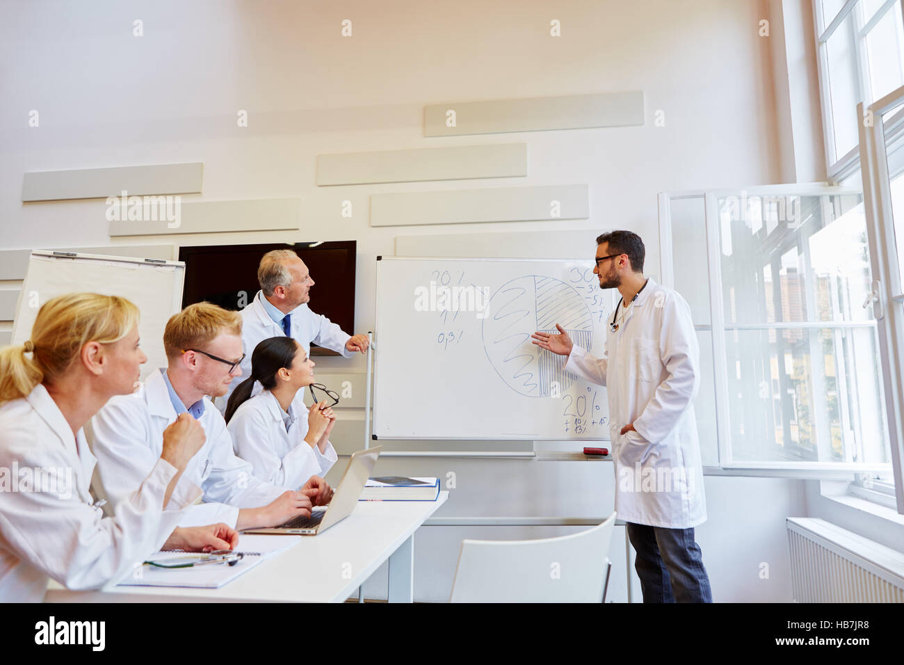 Doctor presenting at medical seminar as training for medicine Stock ...