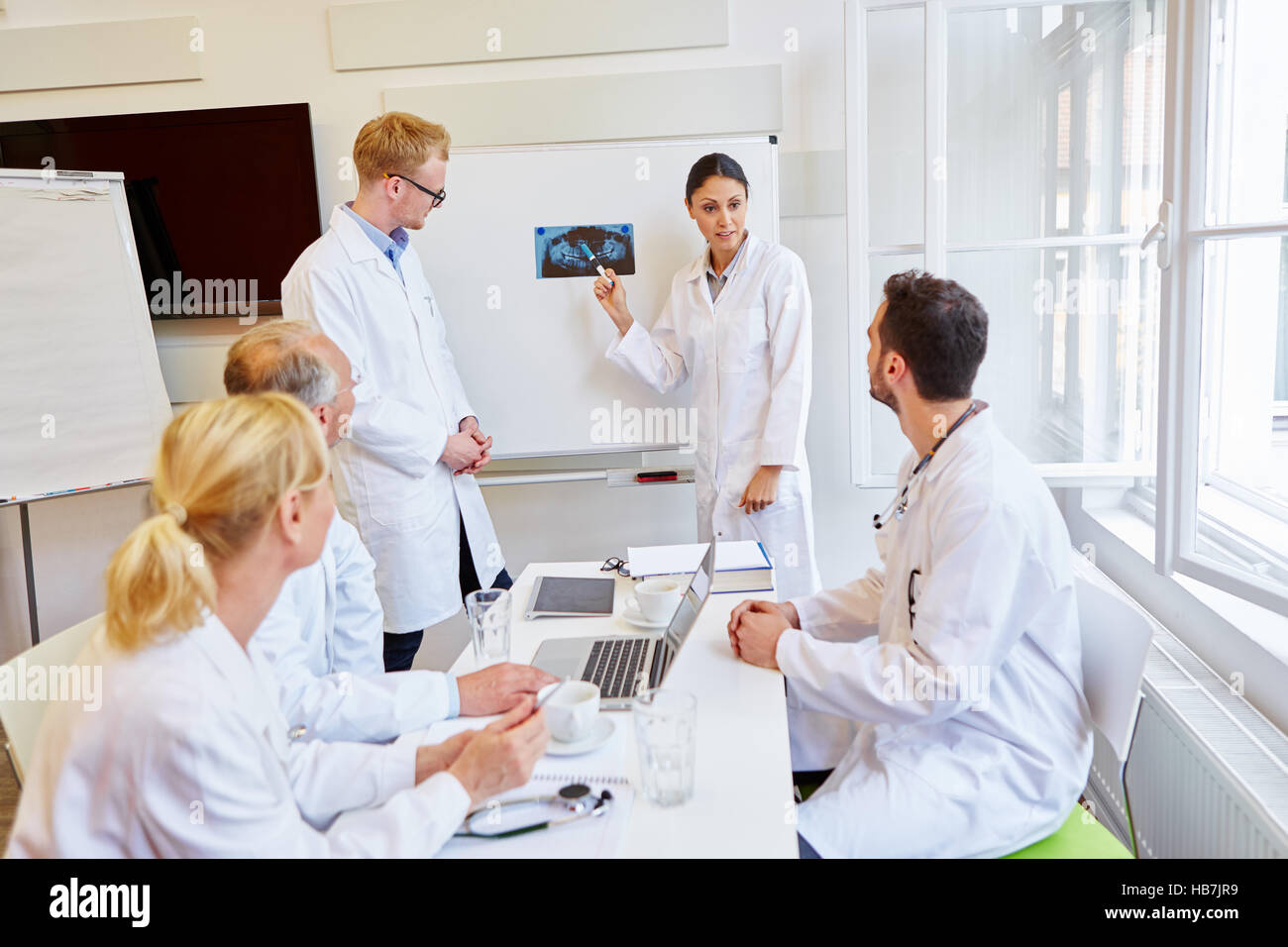 Radiologists presenting x-ray diagnostic to doctors Stock Photo - Alamy