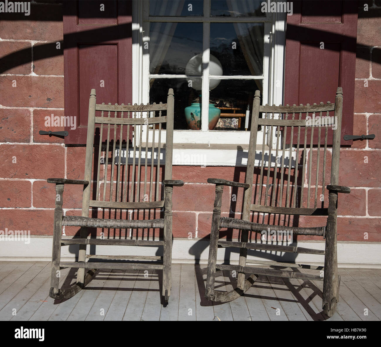 Two rocking chairs in front of an historic house Stock Photo - Alamy