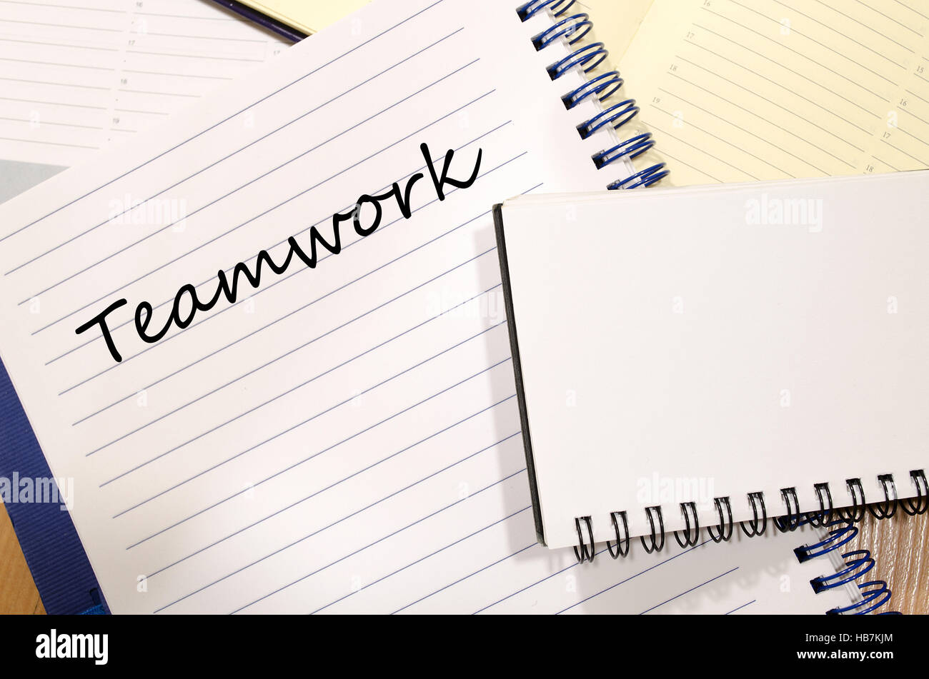 Teamwork write on notebook Stock Photo - Alamy