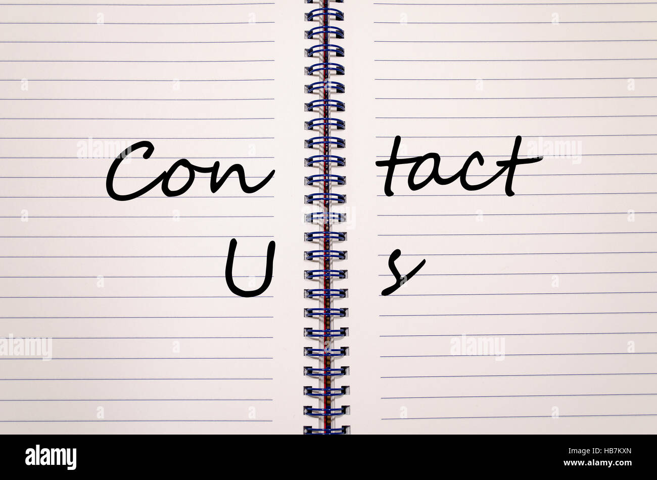 Contact us write on notebook Stock Photo - Alamy