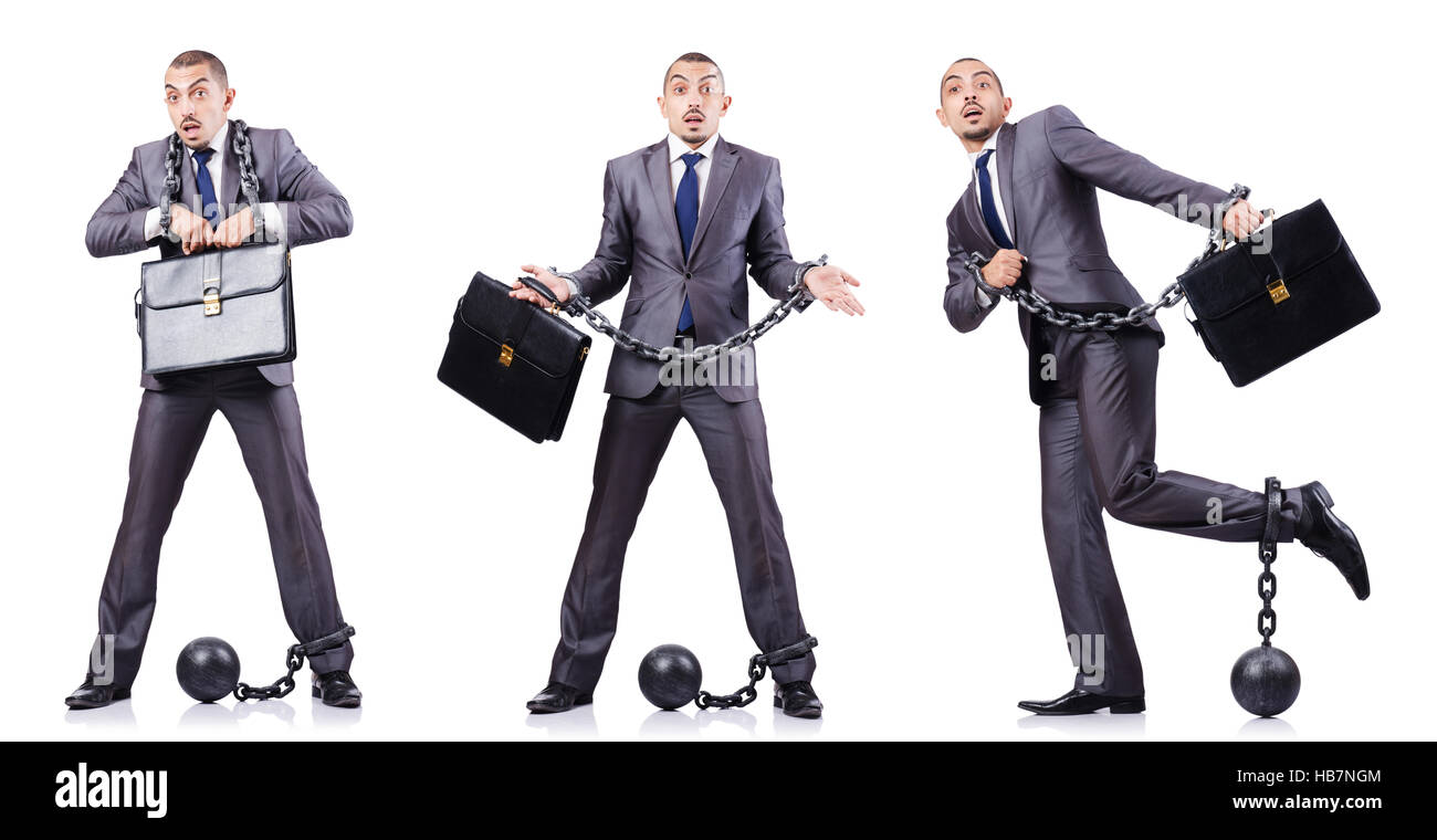 Businessman with shackles on white Stock Photo - Alamy