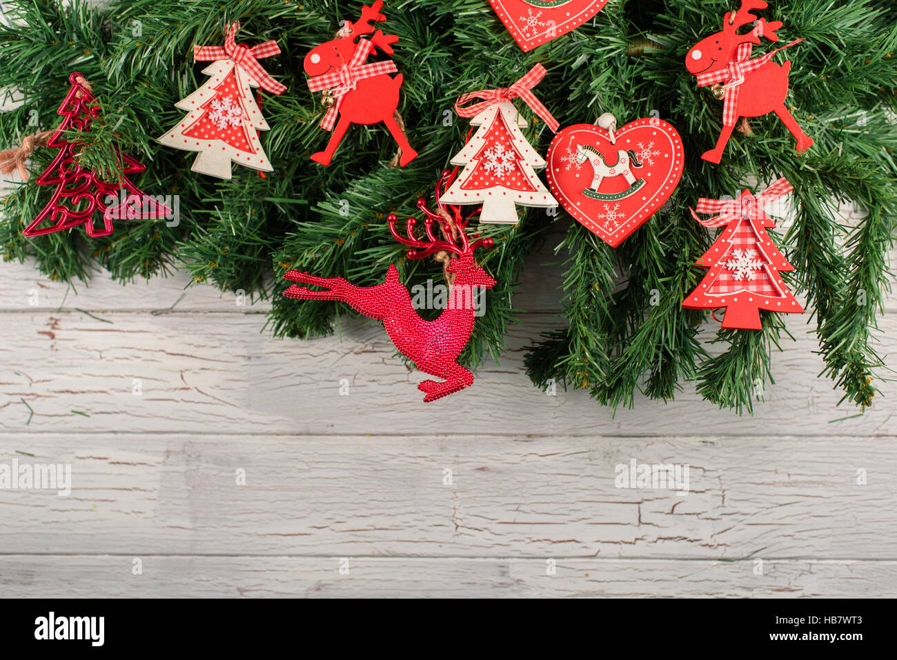 New Year decorations. Christmas tree with red hurts and funny deers on ...