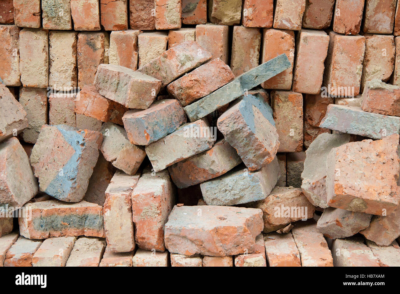 Background of a disorderly heap of Red Bricks on a Construction Site in ...