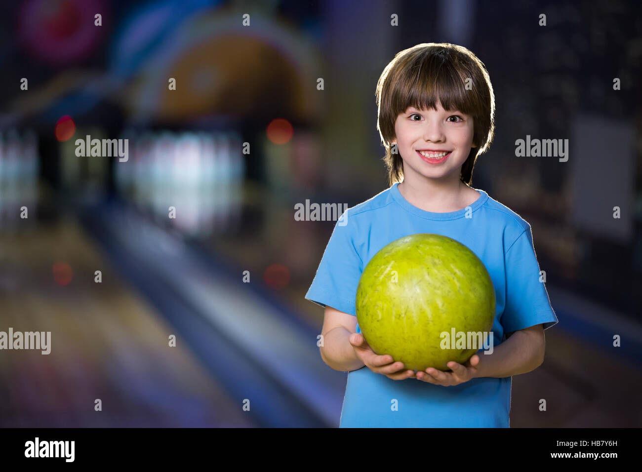Boy with bowling ball Stock Photo - Alamy