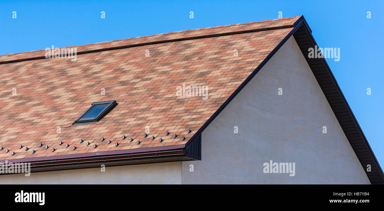 house with a gable roof window Stock Photo - Alamy