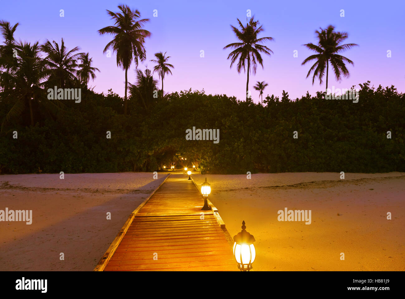 Jetty beach at sunset - Maldives Stock Photo - Alamy