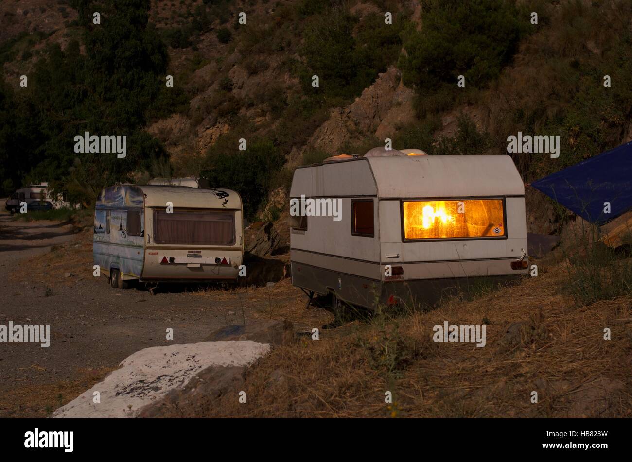 Old caravans by moonlight at Beneficio Alternative community, Spain ...
