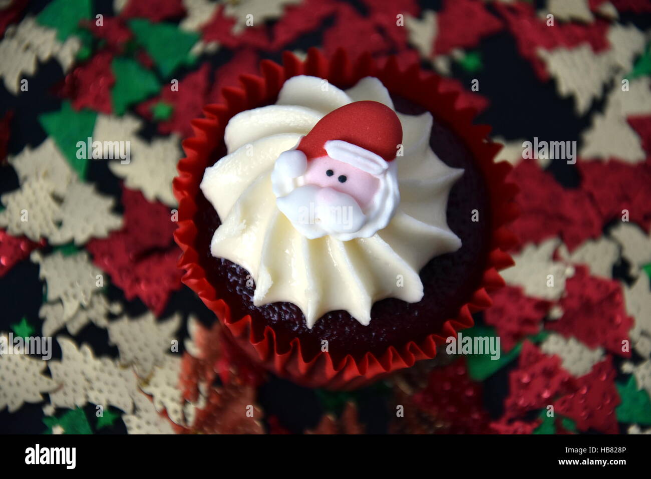 Christmas cupcake with Santa face and whipped cream topping. Xmas ...