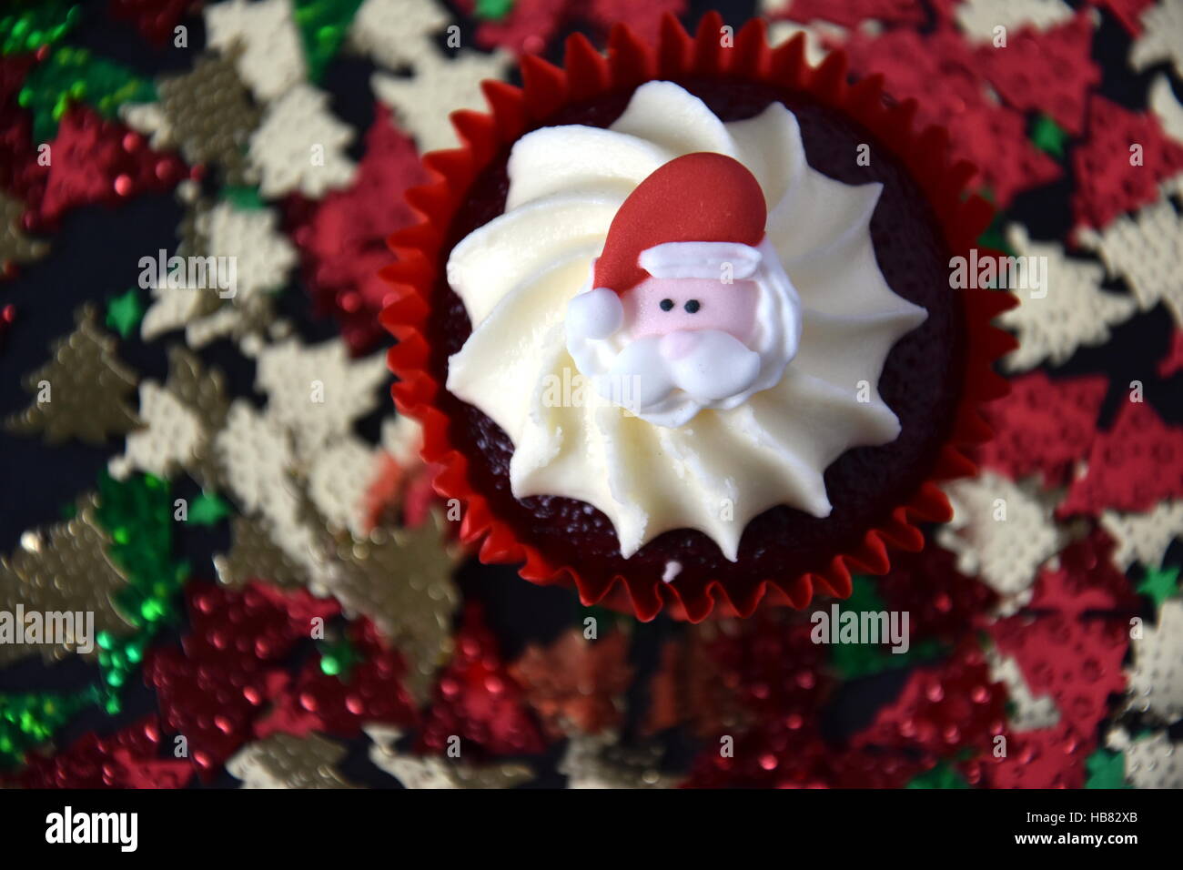 Christmas cupcake with Santa face and whipped cream topping. Xmas ...
