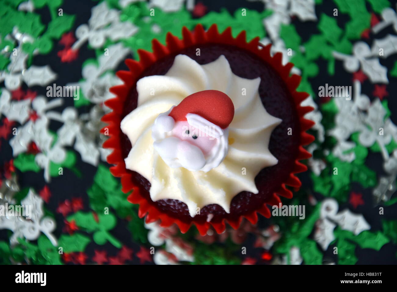 Christmas cupcake with Santa face and whipped cream topping. Xmas ...