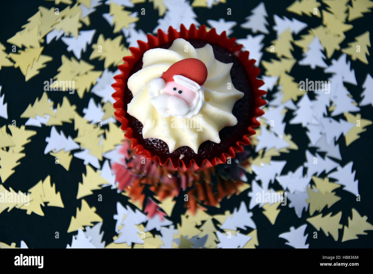 Christmas cupcake with Santa face and whipped cream topping. Xmas ...