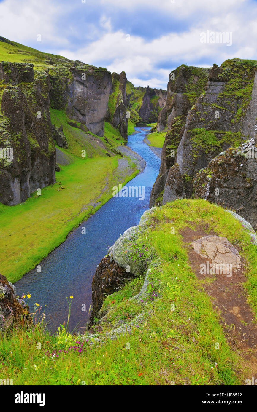 The green grass and blue river Stock Photo - Alamy