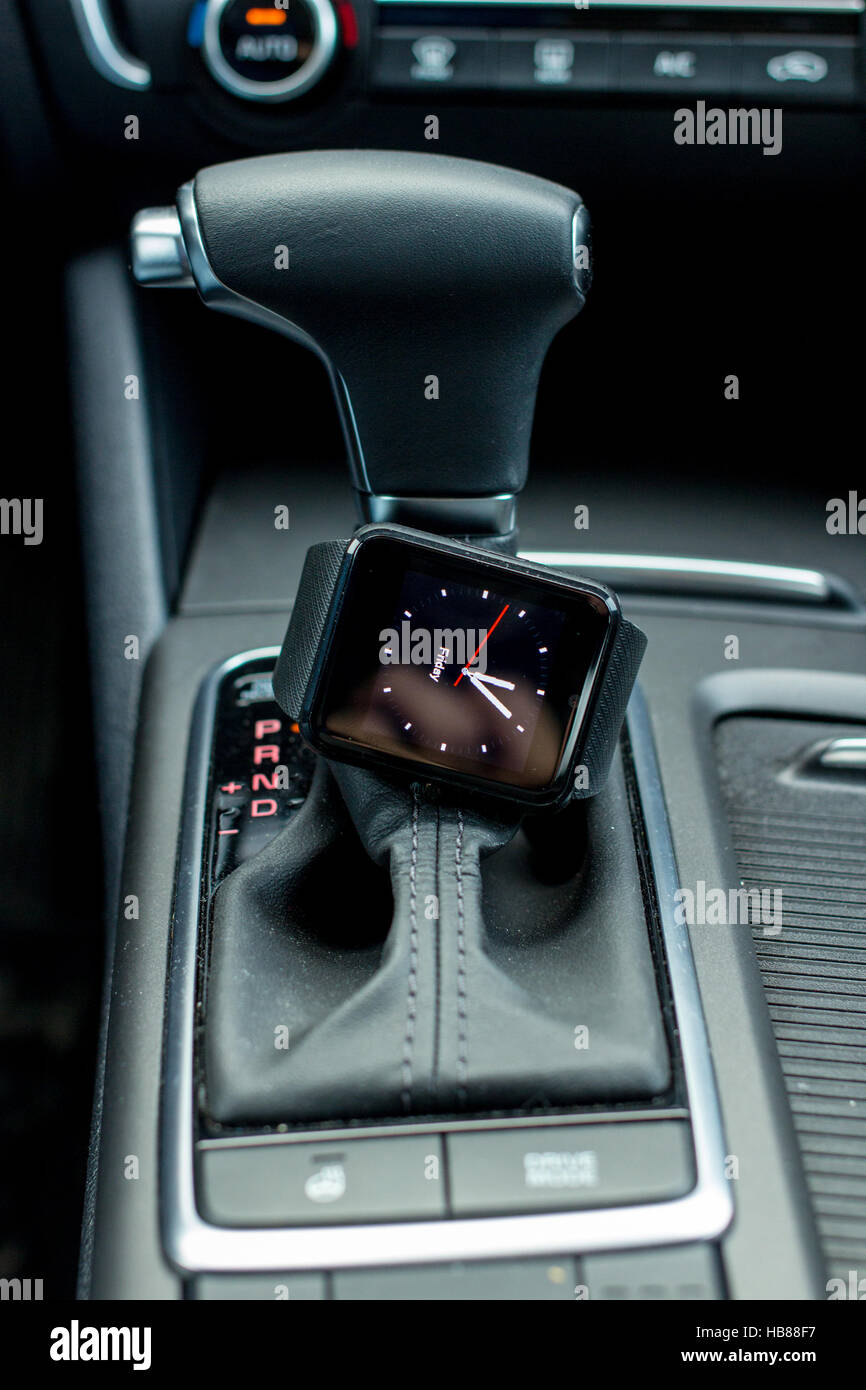 Modern car interior with smart watch on gear stick Stock Photo - Alamy