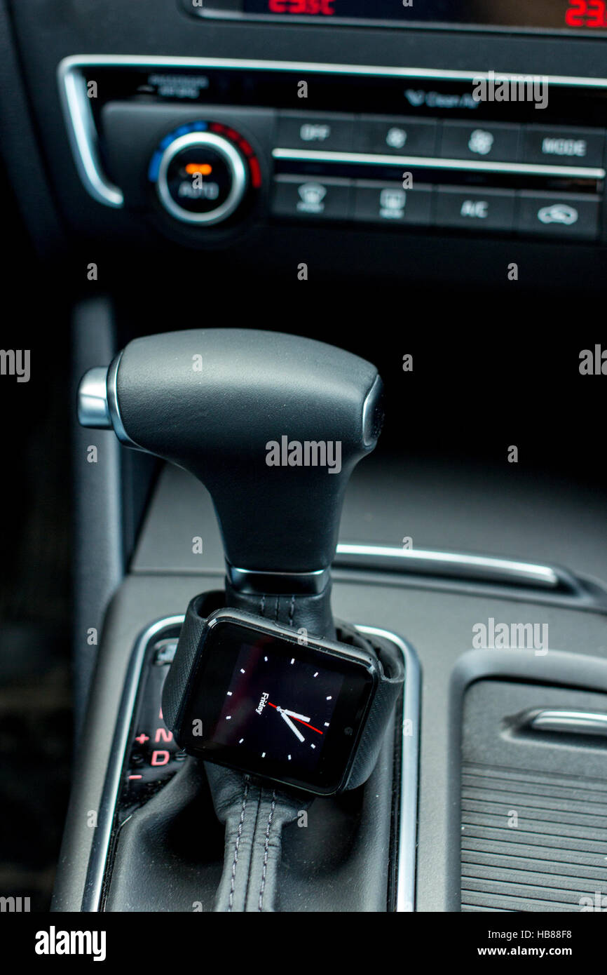 Modern car interior with smart watch on gear stick Stock Photo - Alamy