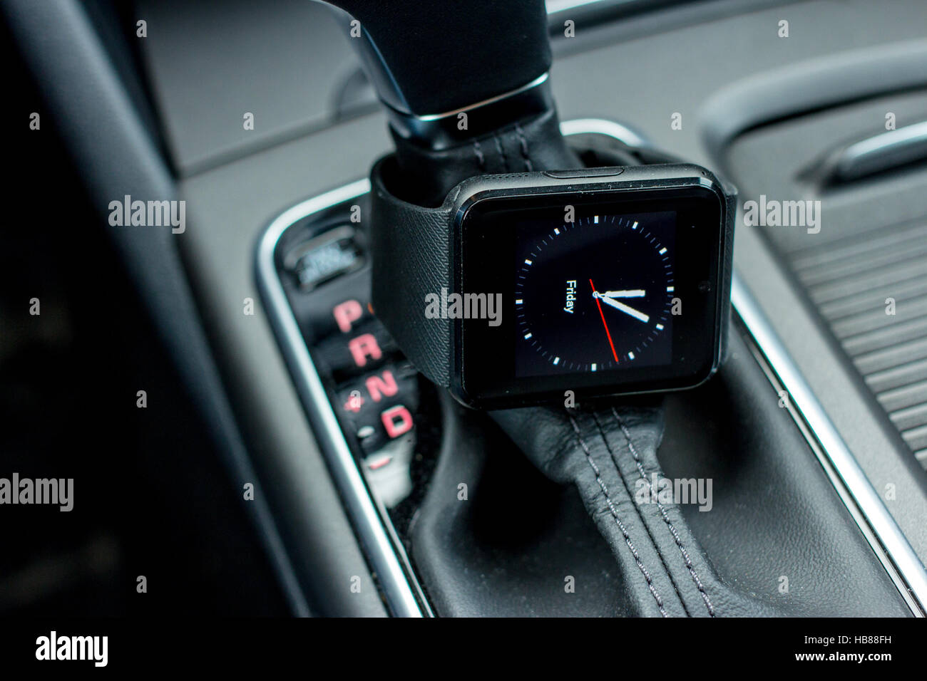 Modern car interior with smart watch on gear stick Stock Photo - Alamy