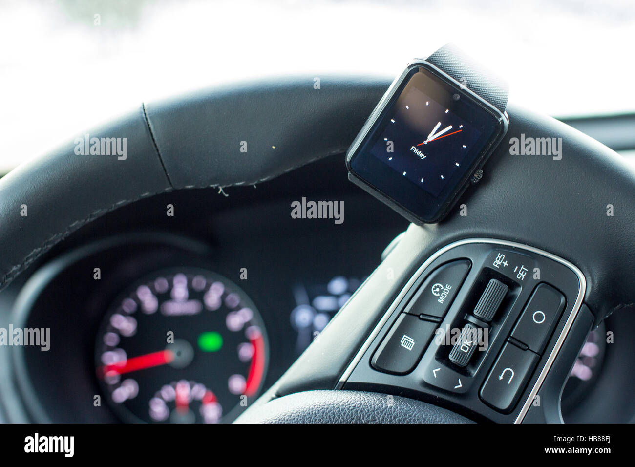 Modern car interior with smart watch on gear stick Stock Photo - Alamy