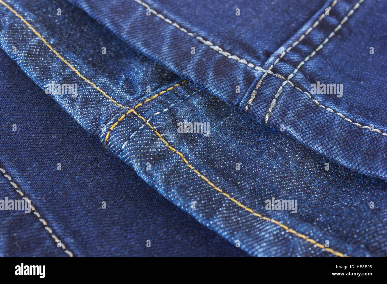 Seams on blue denim trousers Stock Photo - Alamy