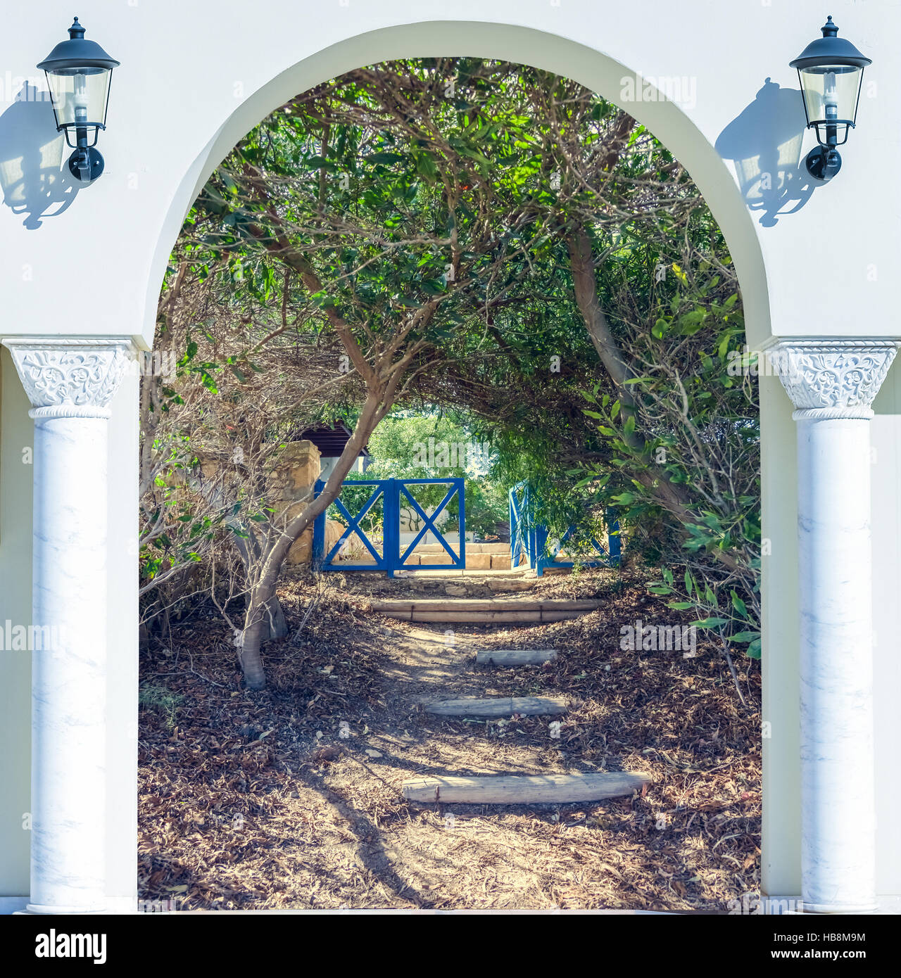 open door arch with alley Stock Photo - Alamy