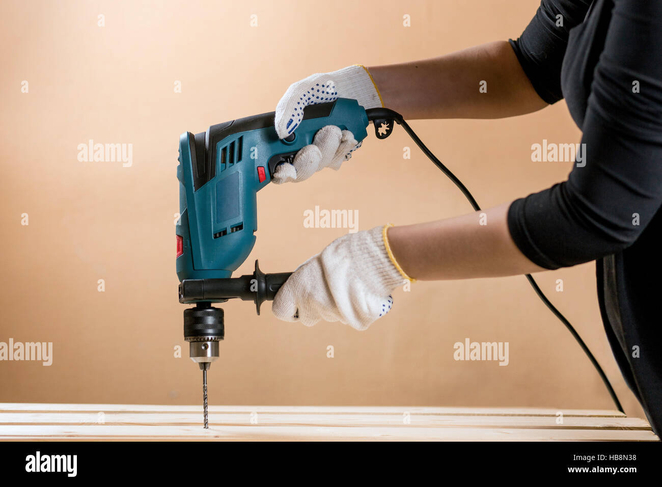 Female carpenter hand drill hi-res stock photography and images - Alamy