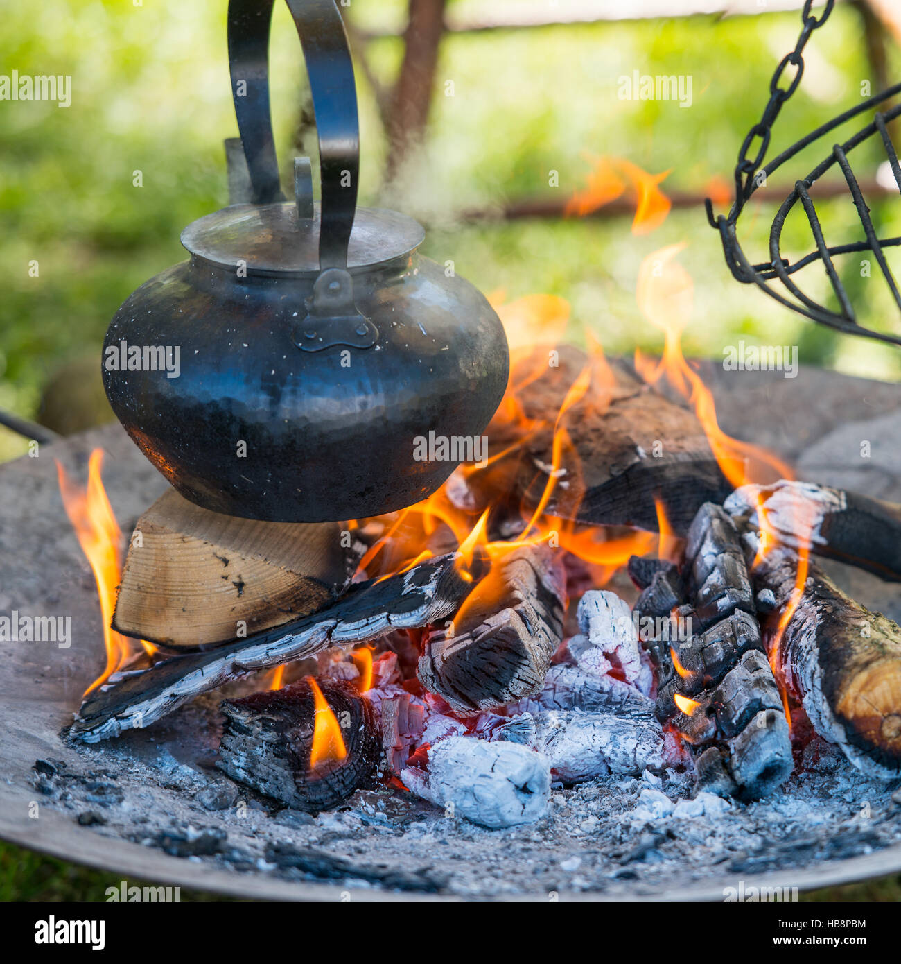 boiling over the fire Stock Photo - Alamy