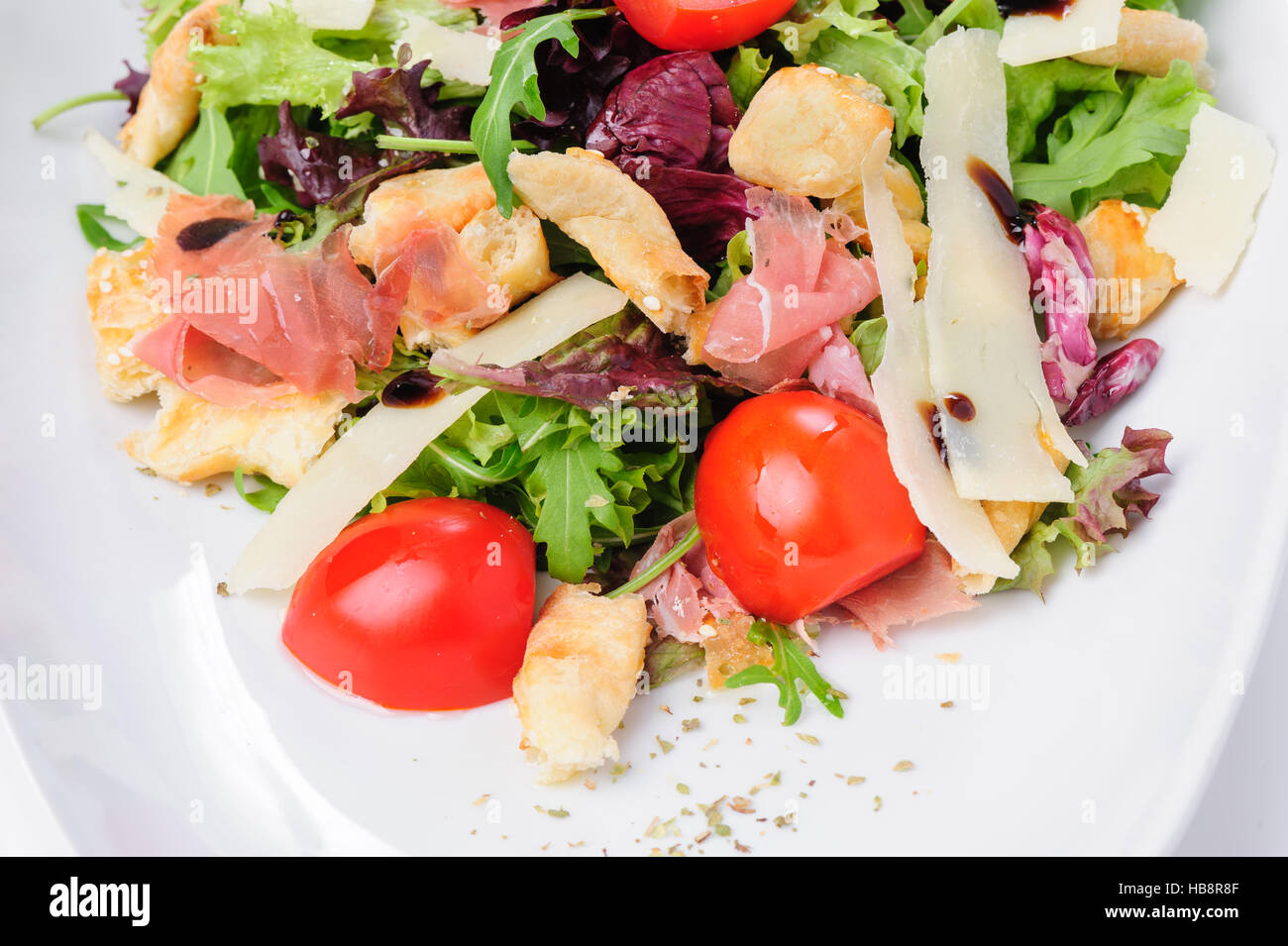 Salad with prosciutto, parmigiano, tomato and ruccola Stock Photo - Alamy