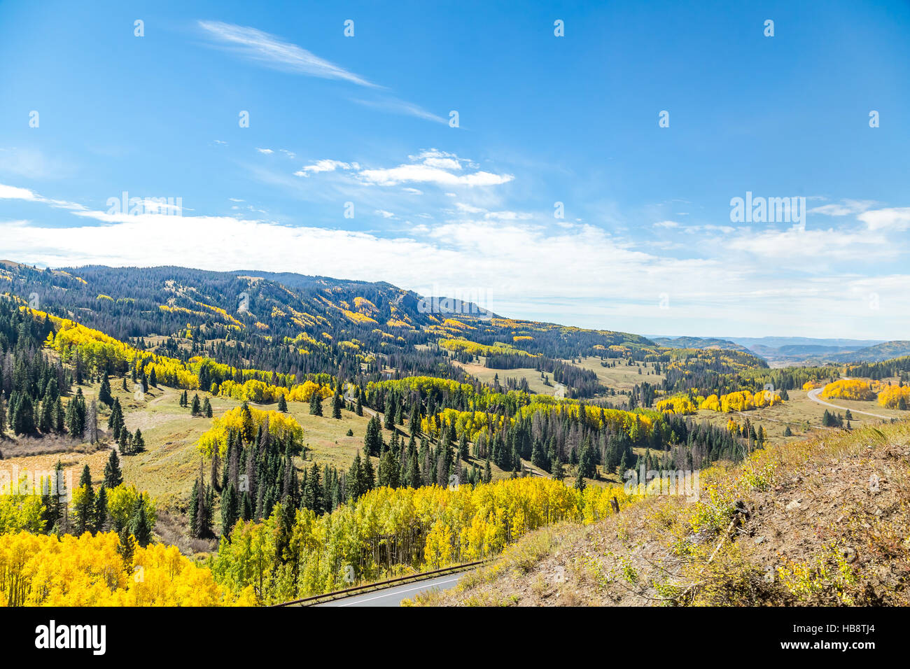 Mountain scenery with streams, valleys, and colorful trees along a ...