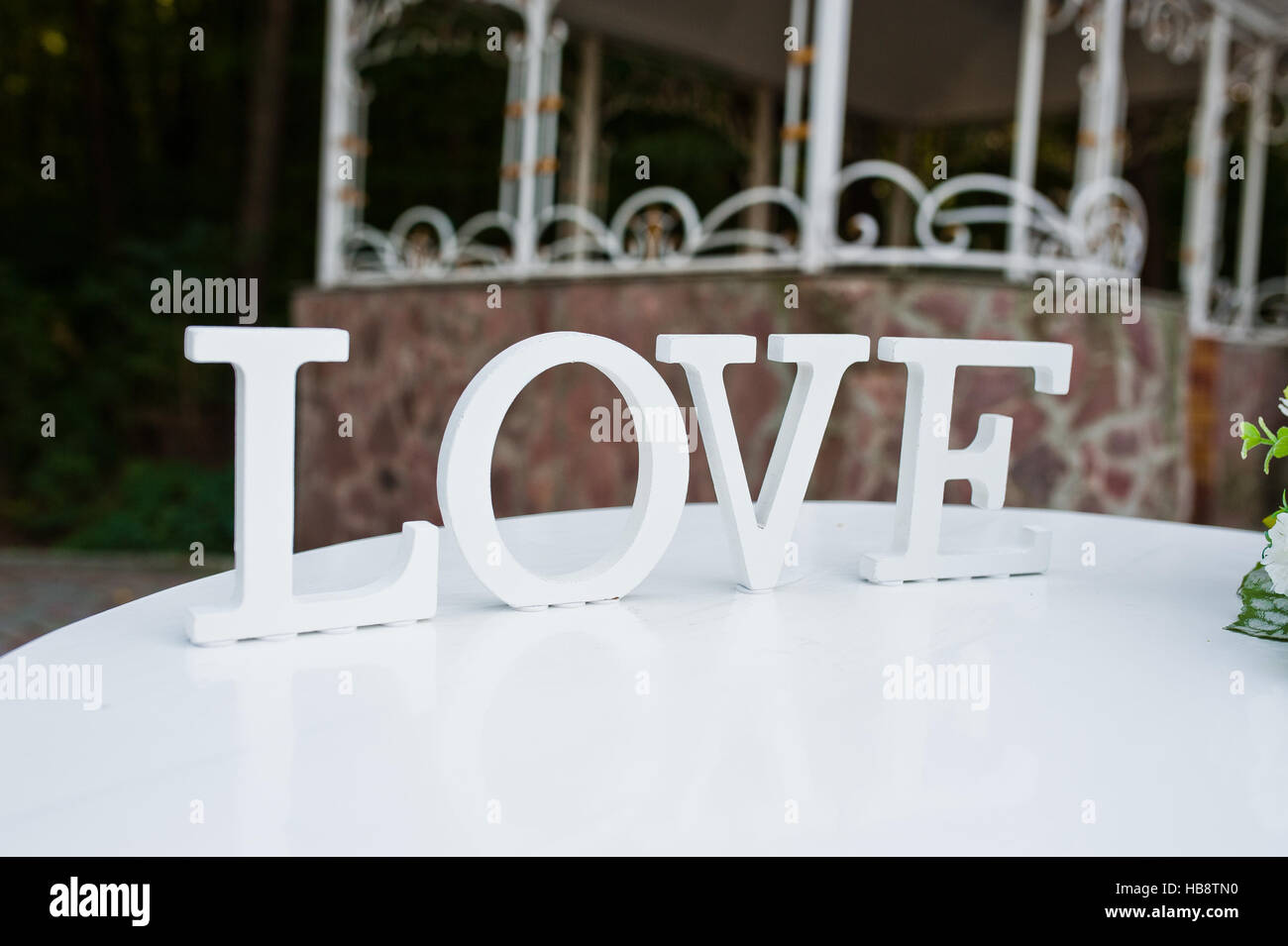 Decor word LOVE on table wedding ceremony Stock Photo - Alamy