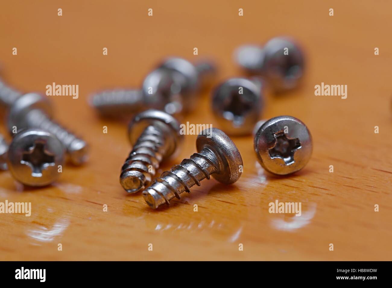 Screws on a table Stock Photo - Alamy