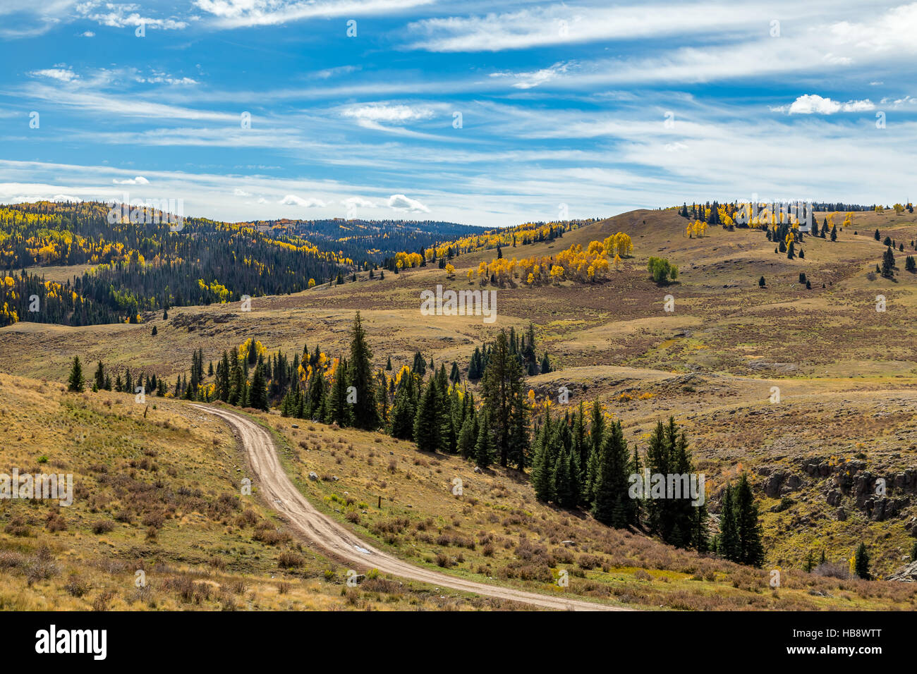 Mountain scenery with streams, valleys, and colorful trees along a ...