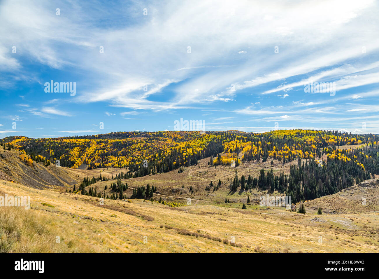 Mountain scenery with streams, valleys, and colorful trees along a ...